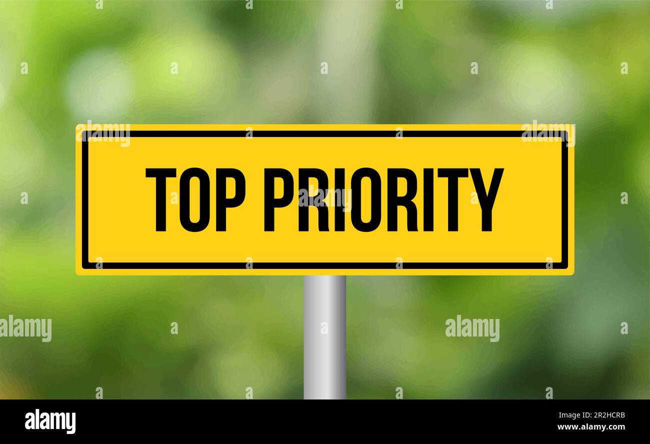 Top priority road sign on blur background Stock Photo - Alamy