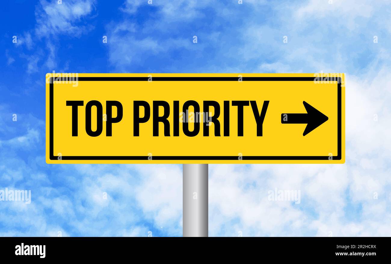 Top priority road sign on cloudy sky background Stock Photo - Alamy