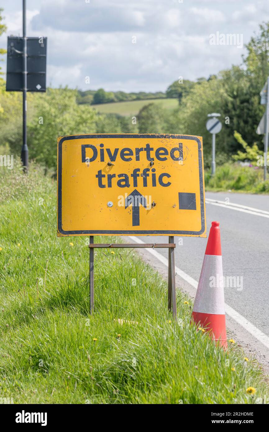 UK road transport system. Orange and white road cone & diverted traffic ... UK road transport system. Orange and white road cone & diverted traffic ...