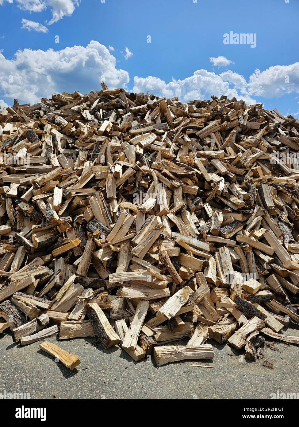 Logs, split and ready for fire. A pile of seasoned wood, awaiting ...