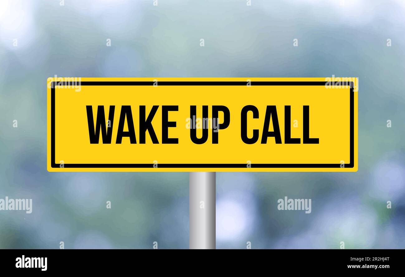 Wake up call road sign on blur background Stock Photo - Alamy