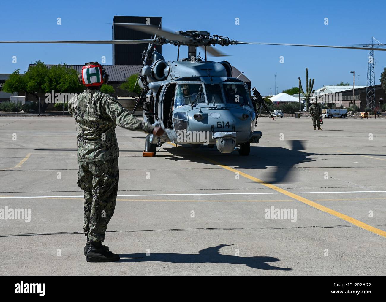 A U.S. Navy Sailor, assigned to the Helicopter Sea Combat Squadron 14 ...