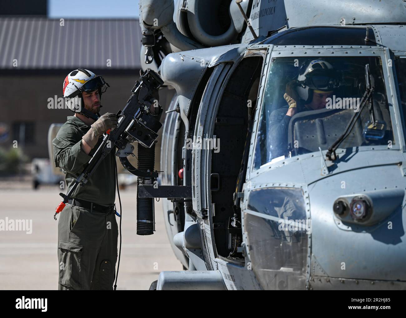 A U.S. Navy Sailor, assigned to the Helicopter Sea Combat Squadron 14 ...