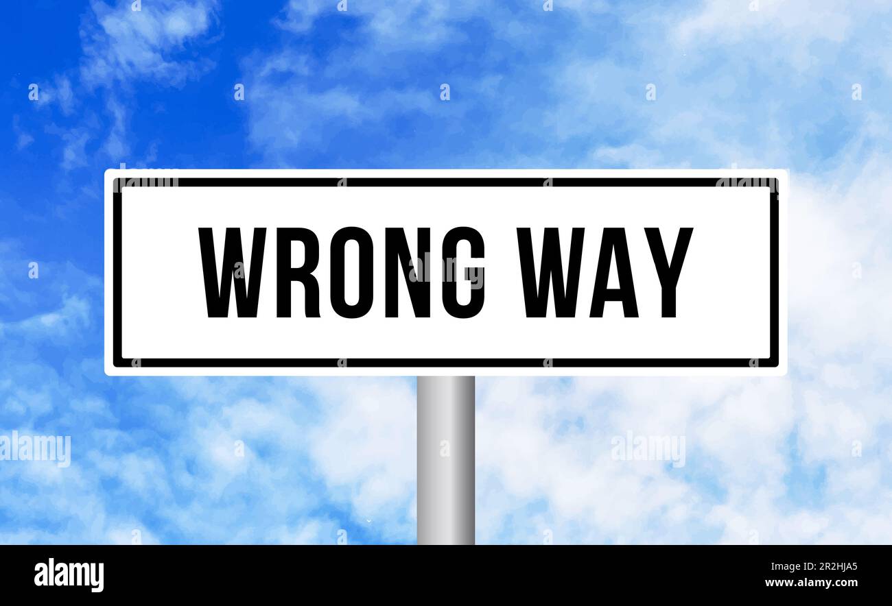 Wrong way road sign on sky background Stock Photo - Alamy