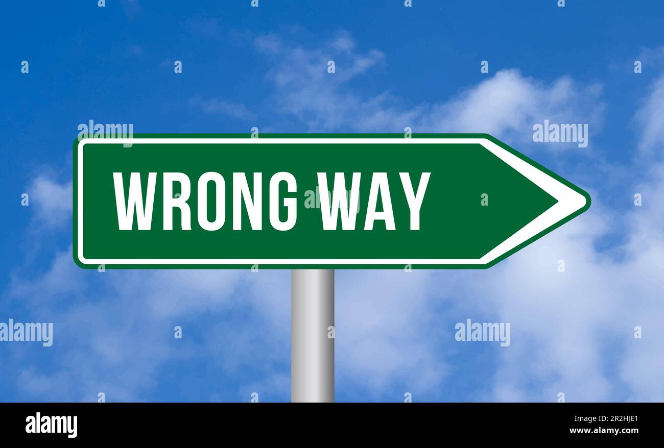 Wrong way road sign on sky background Stock Photo - Alamy