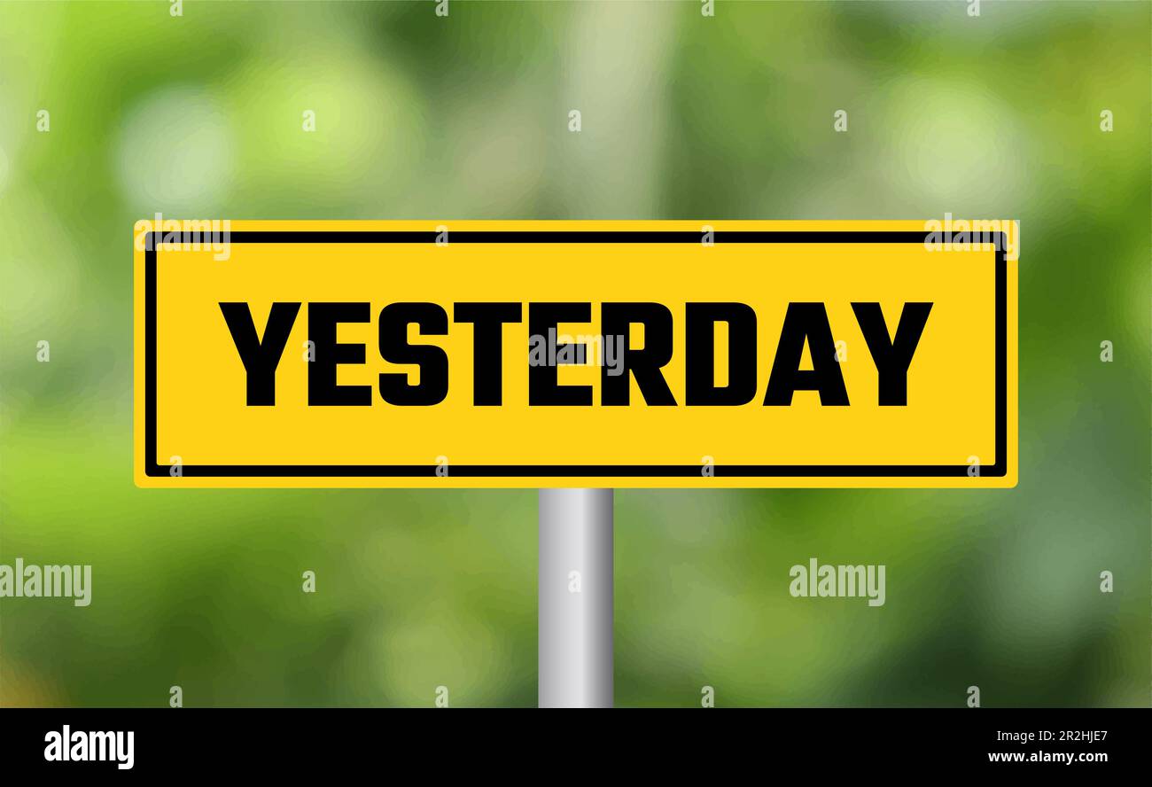 Yesterday road sign on blur background Stock Photo - Alamy
