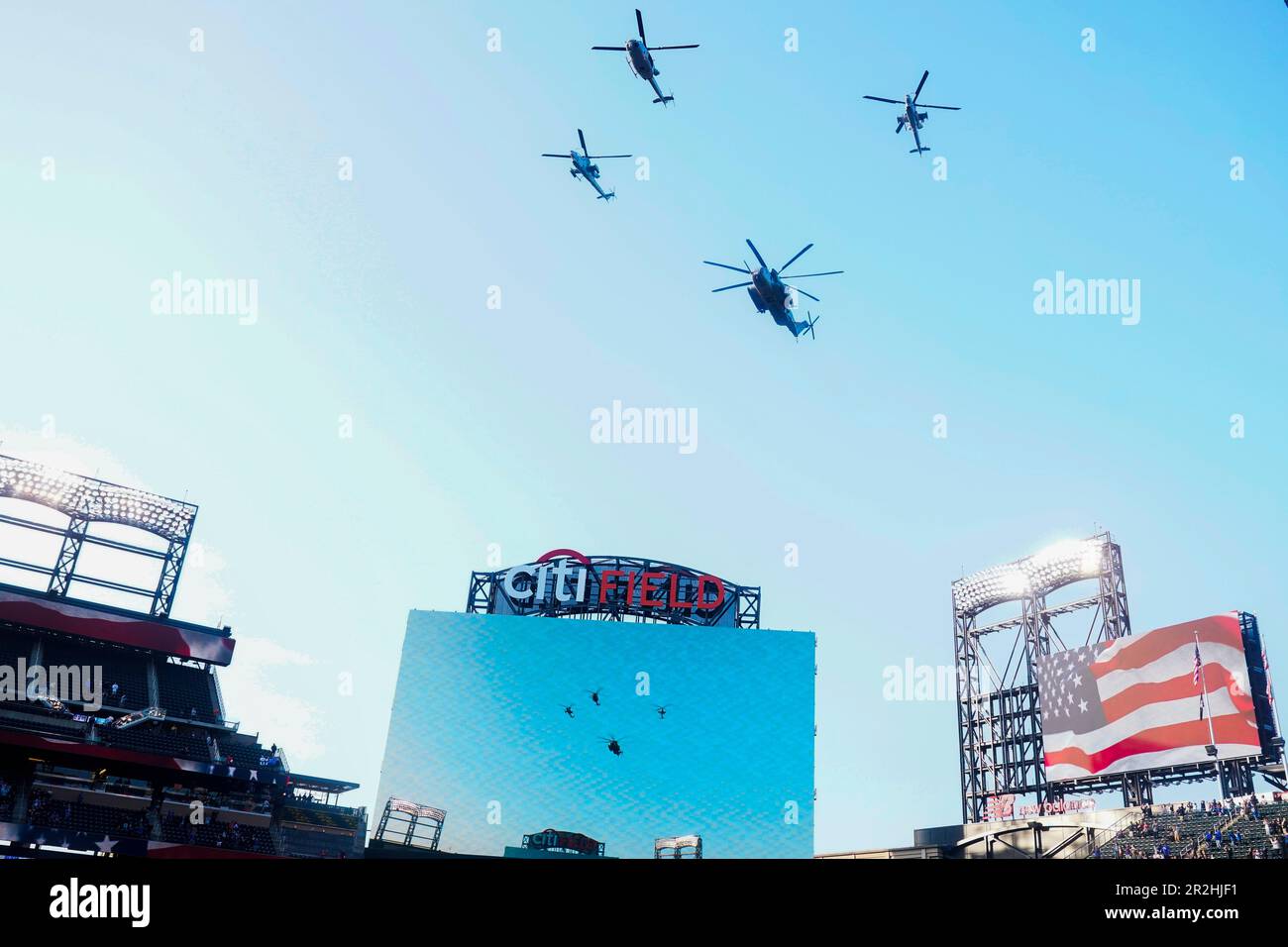 Military helicopters fly over Citi Field before a baseball game between ...