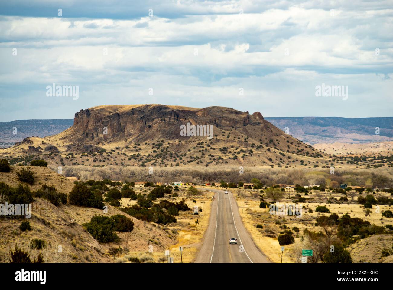 Road in landscape with mesa mountain, New Mexico Stock Photo - Alamy