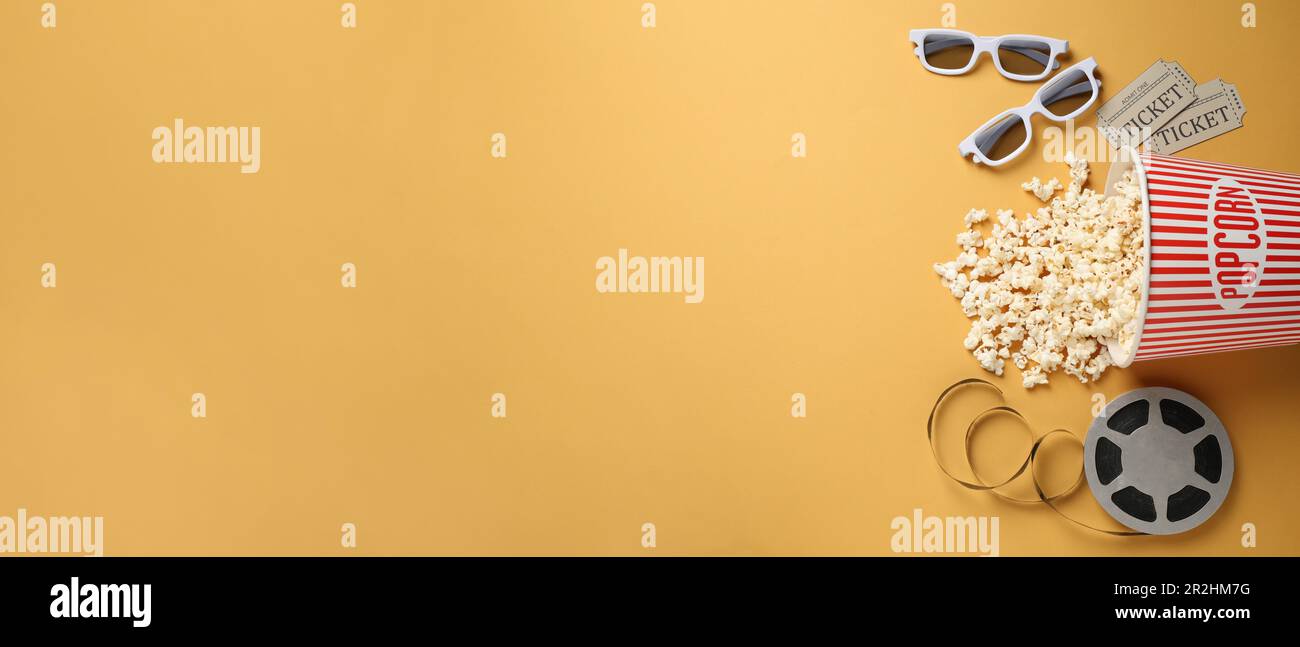 Flat lay composition with delicious popcorn and cinema tickets on ...