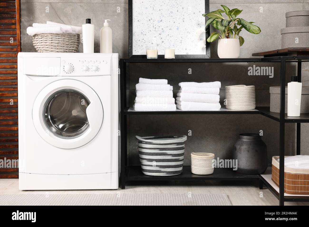 Stylish laundry room with modern washing machine. Interior design Stock ...