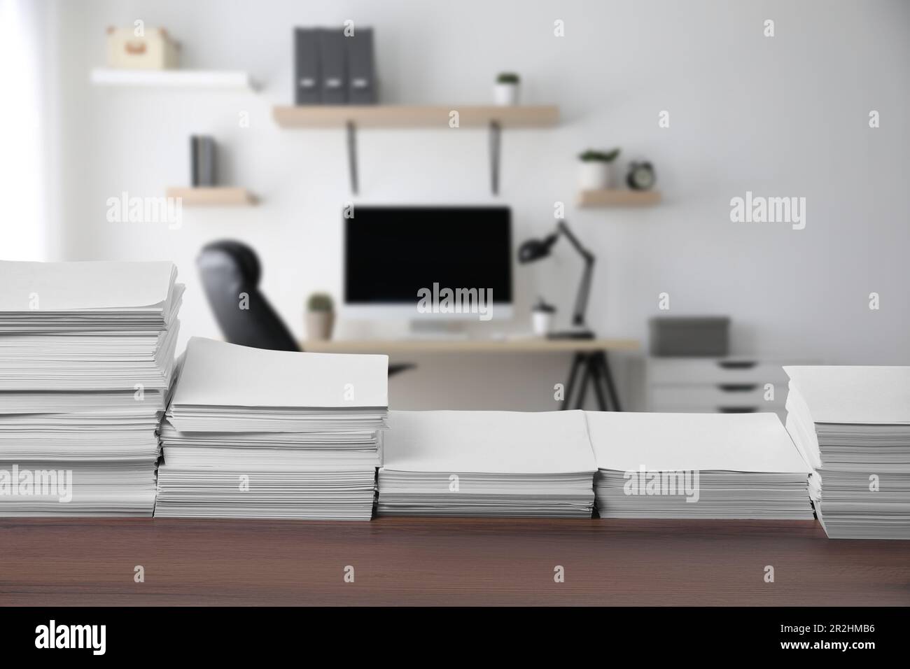 Stacked sheets of paper on wooden table in office, space for text Stock ...