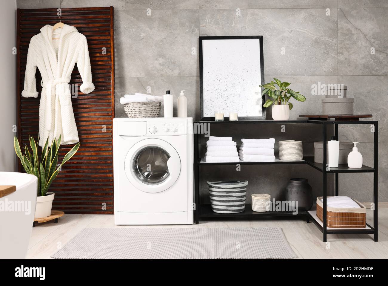 Stylish laundry room with modern washing machine. Interior design Stock ...