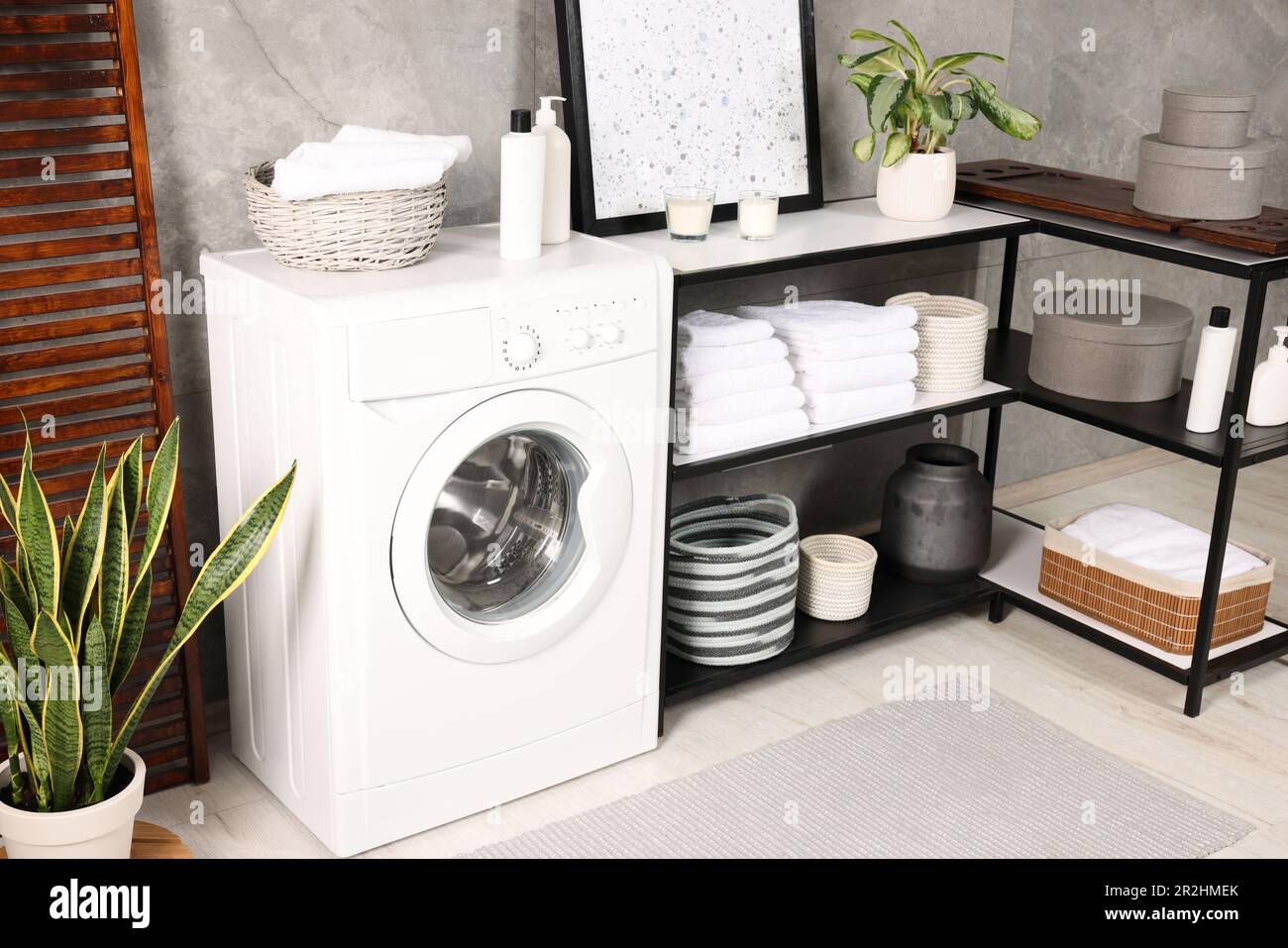 Stylish laundry room with modern washing machine. Interior design Stock ...