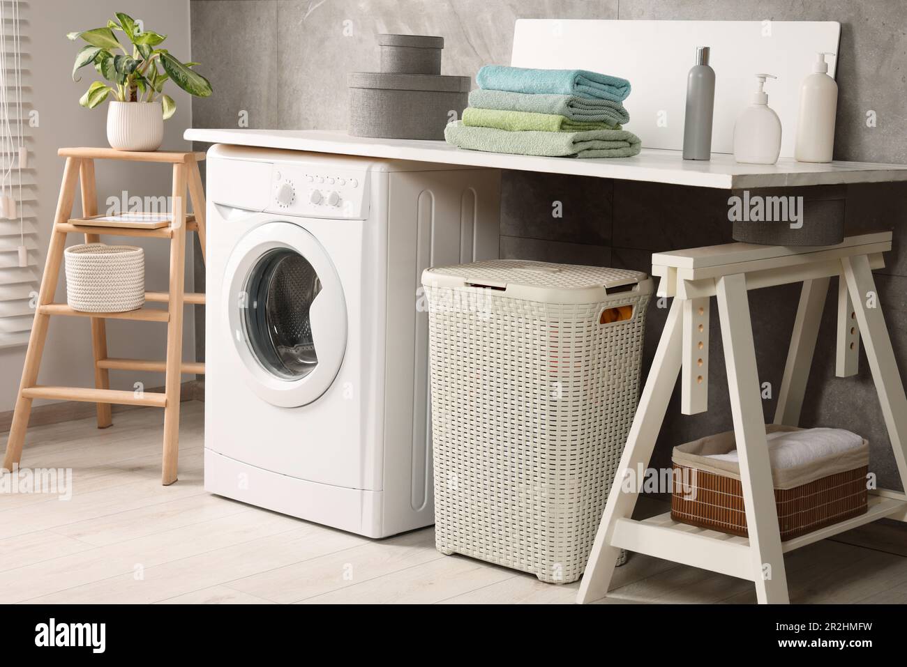 Stylish laundry room with modern washing machine. Interior design Stock ...