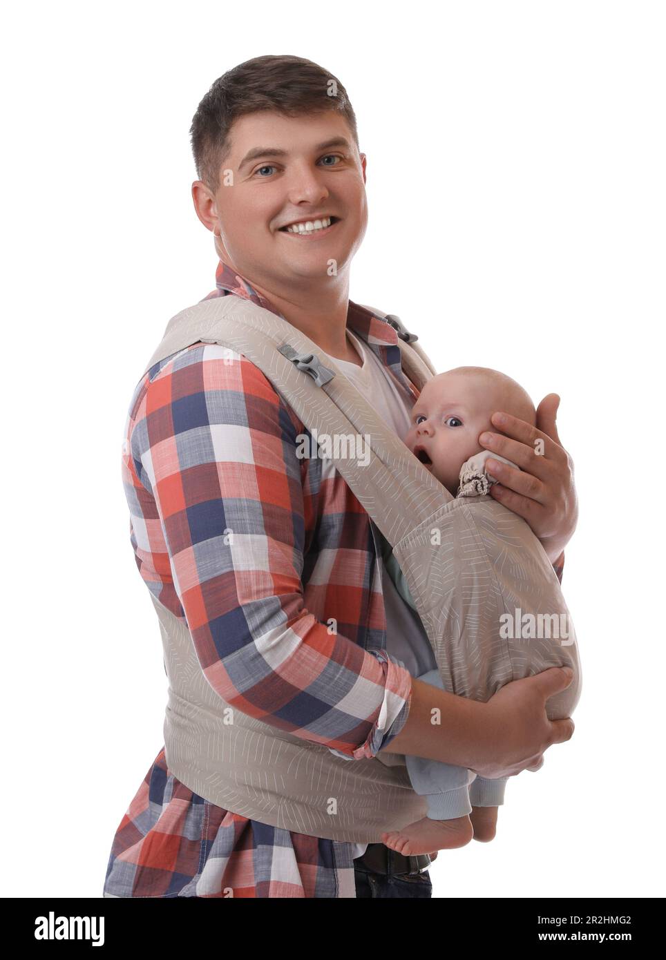 Father holding his child in baby carrier on white background Stock ...