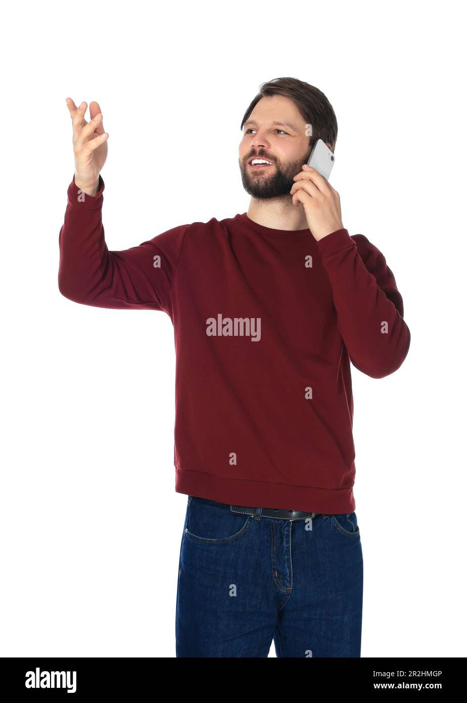 Man talking on smartphone against white background Stock Photo - Alamy