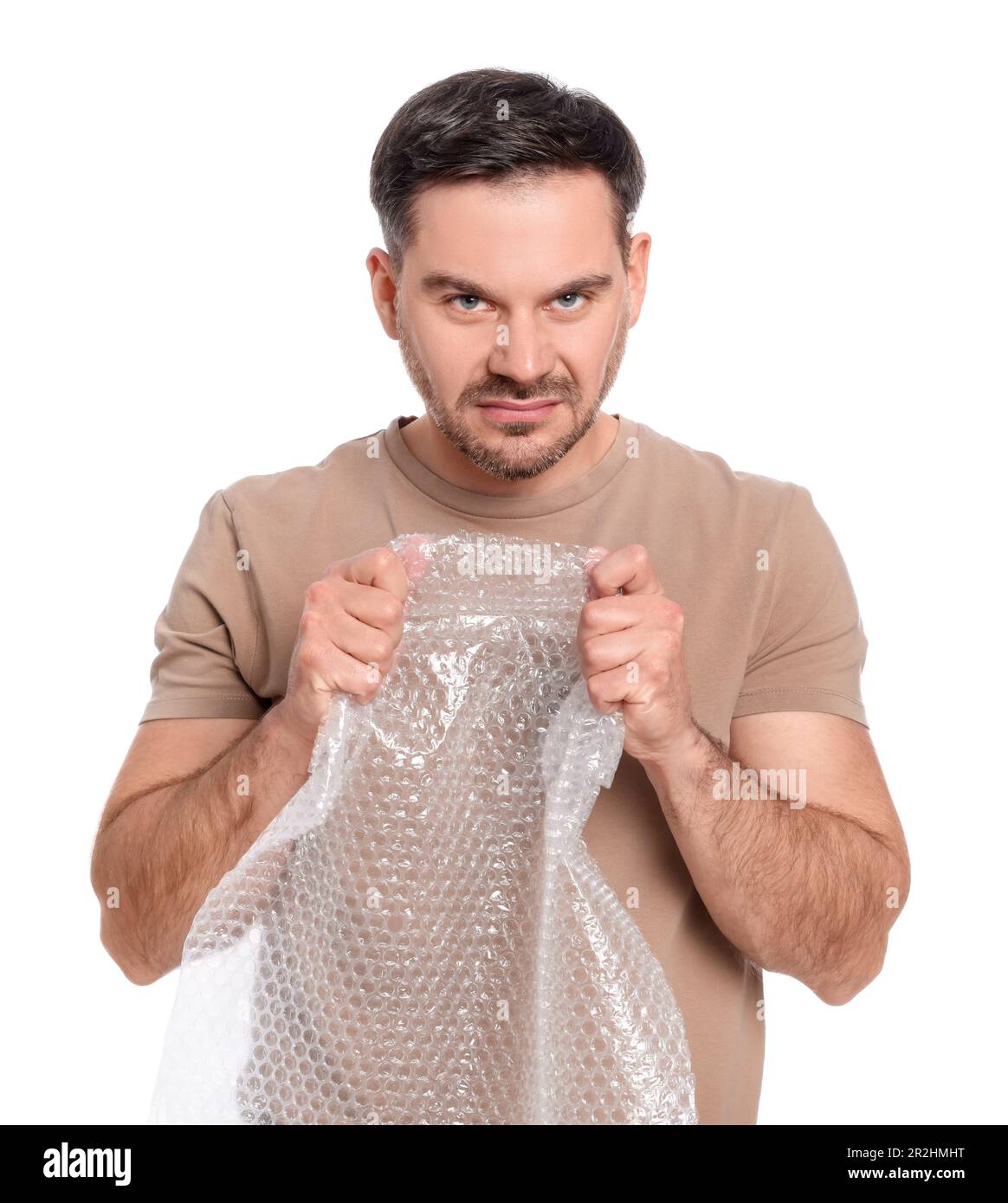 Emotional man with bubble wrap on white background Stock Photo - Alamy