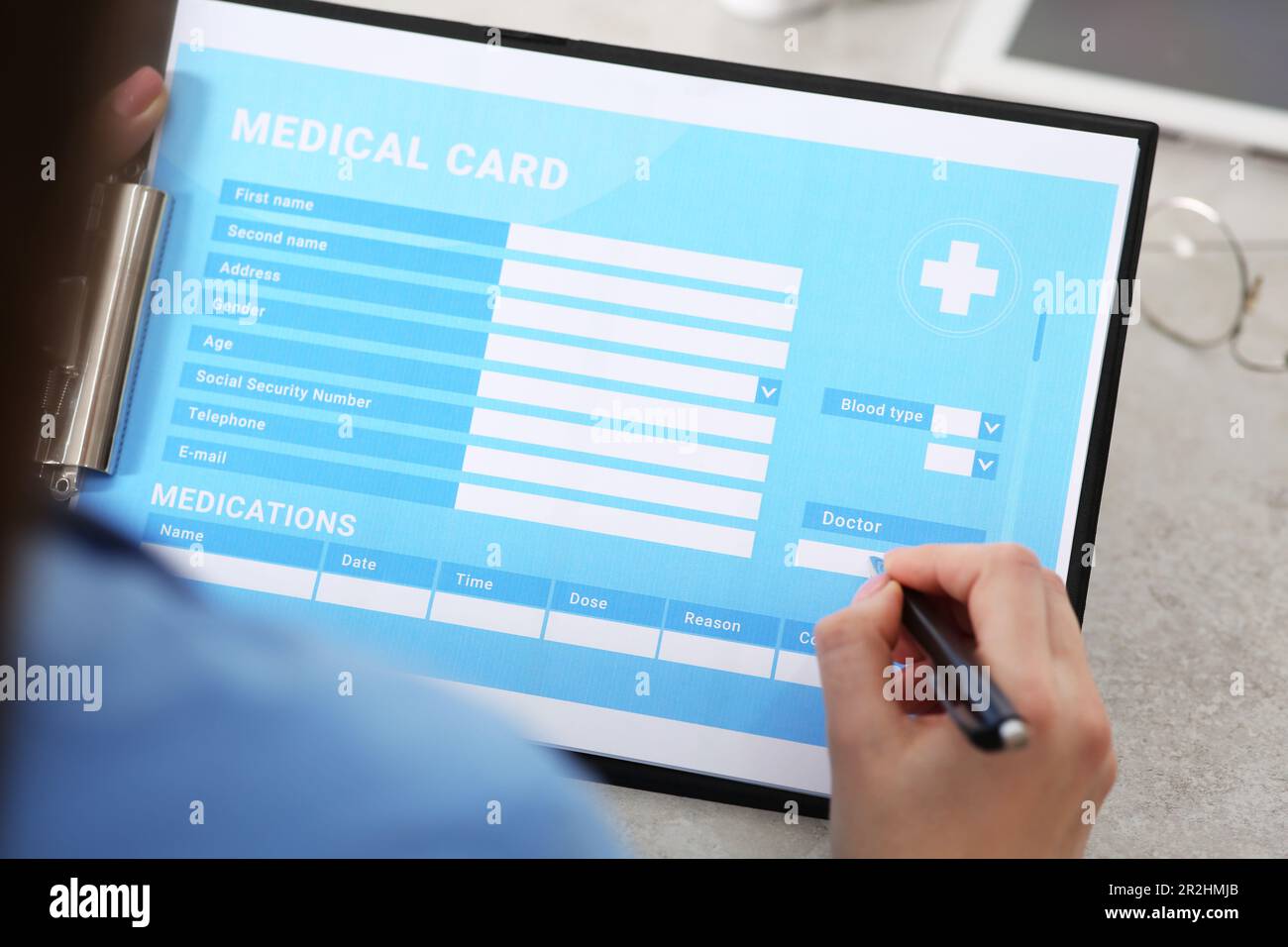 Doctor filling patient's medical card in clinic, closeup Stock Photo ...