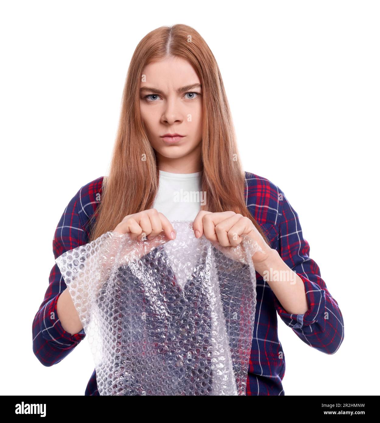 Angry woman popping bubble wrap on white background. Stress relief ...