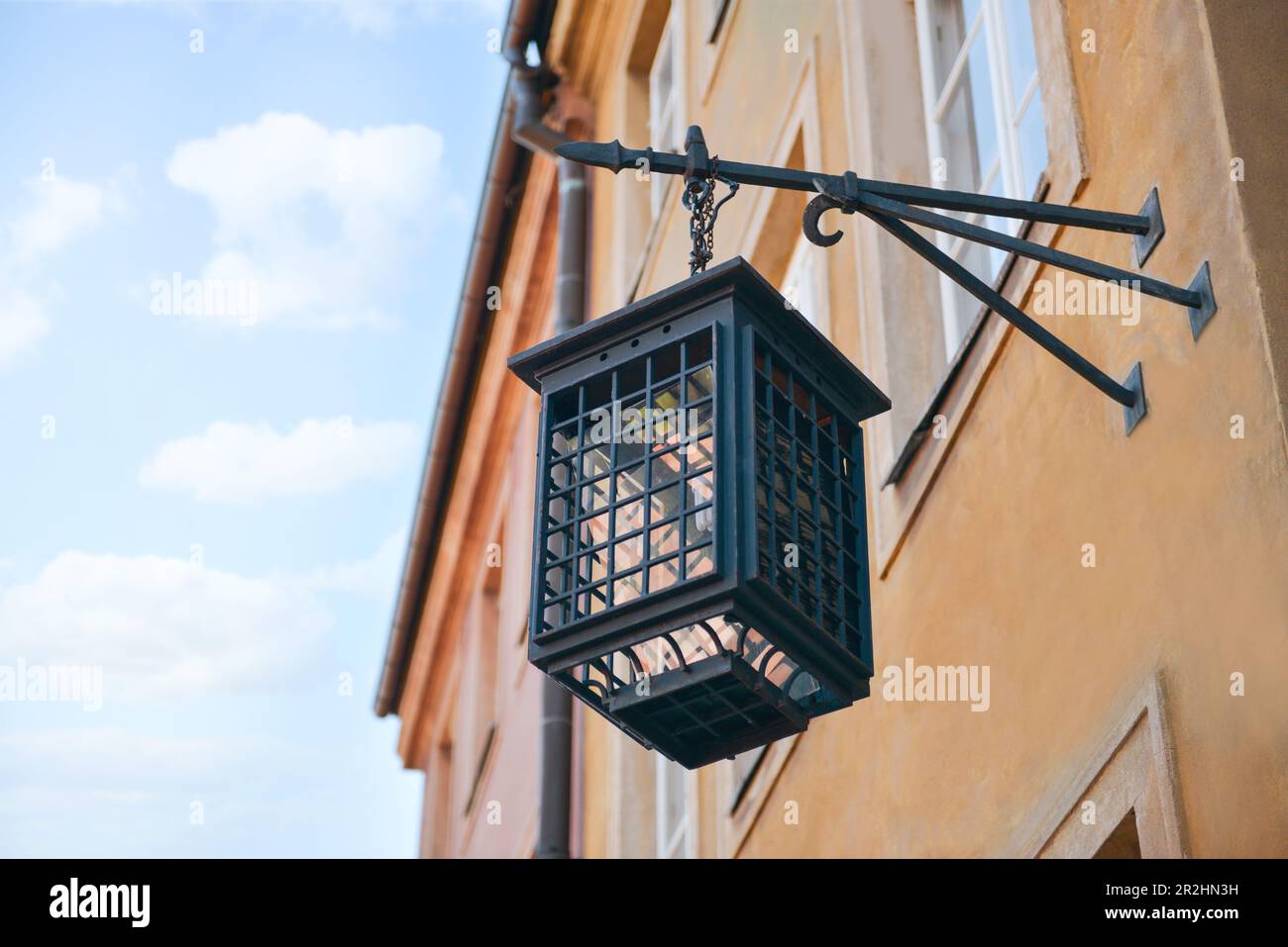 Beautiful vintage street lamp hanging on wall of building Stock Photo ...