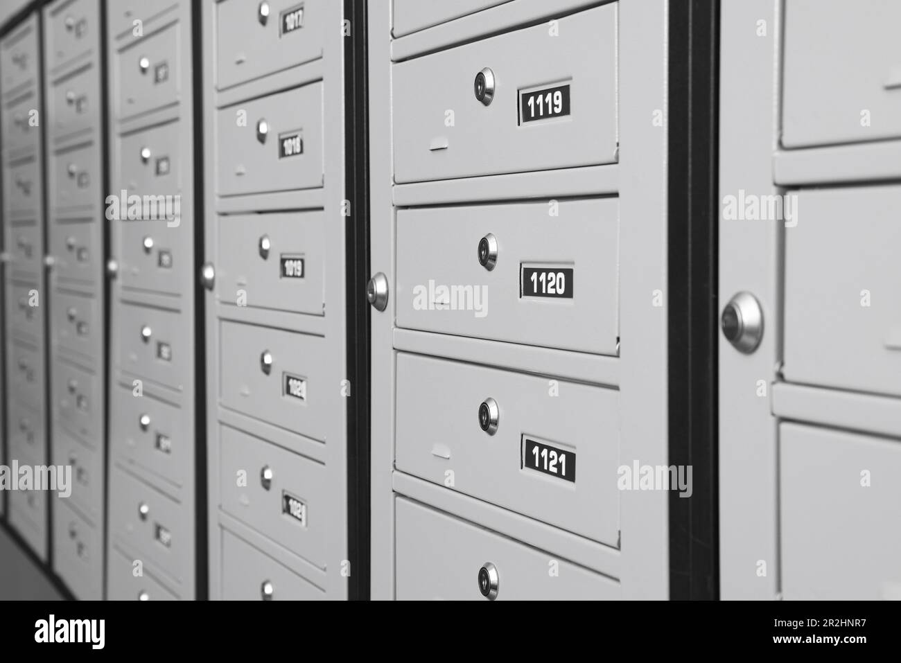 Closed metal mailboxes with keyholes and sequence numbers indoors Stock ...