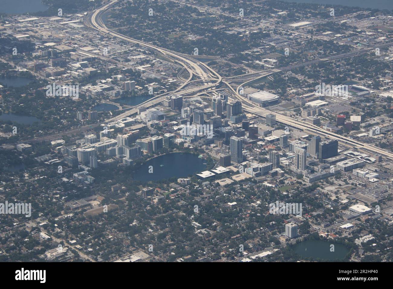 A bustling cityscape surrounded by lush greenery, Orlando, Florida ...