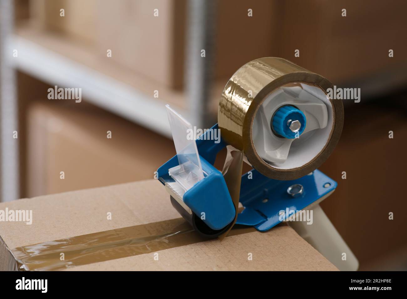 Taping box with adhesive tape dispenser indoors. Space for text Stock ...