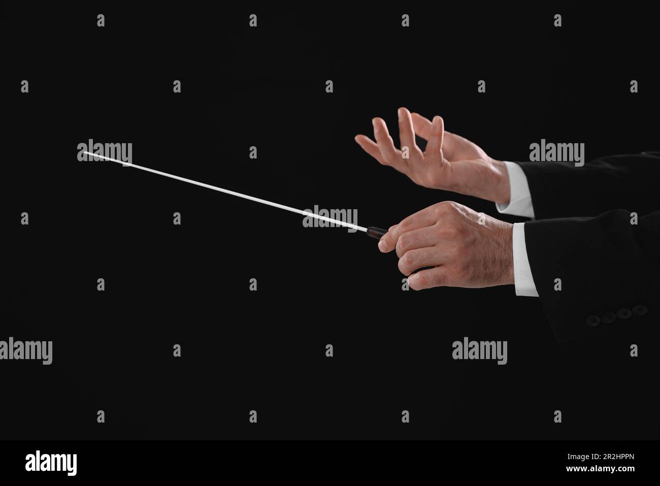 Professional conductor with baton on black background, closeup Stock ...