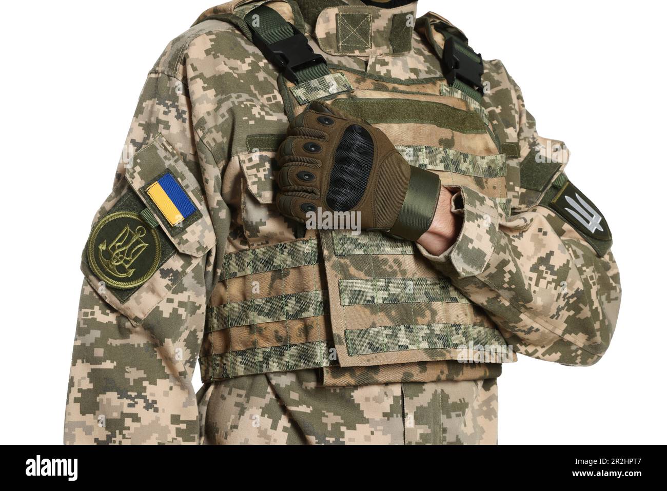 Soldier with Ukrainian flag and trident on military uniform against ...