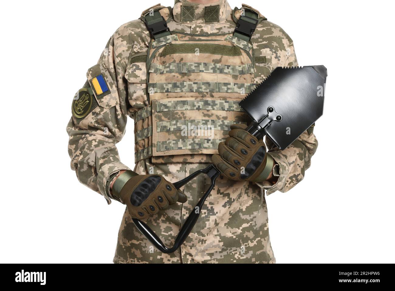 Soldier in Ukrainian military uniform with folding sapper shovel on ...