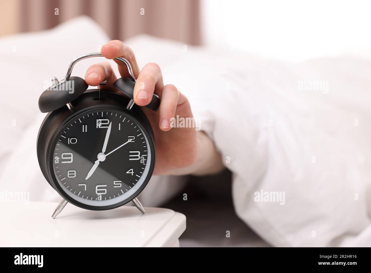 Man alarm clock switch off hi-res stock photography and images - Alamy