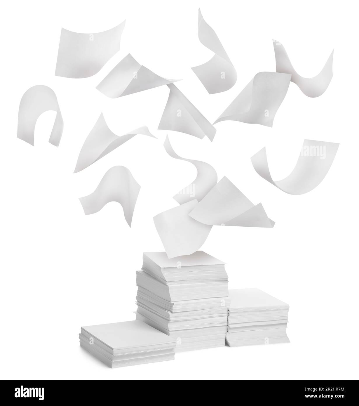 Sheets of paper falling onto stacked ones on white background Stock ...