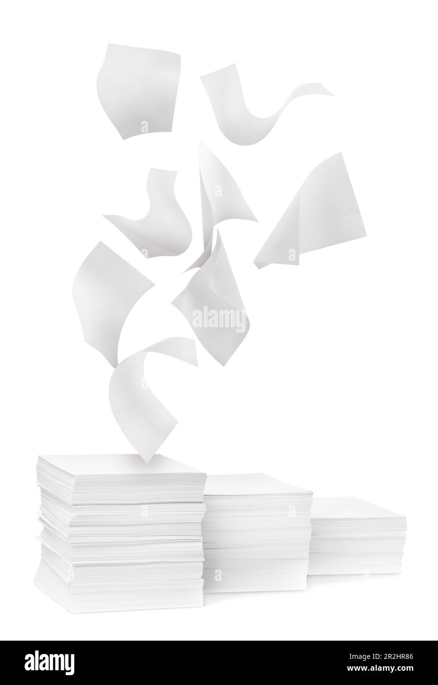 Sheets of paper falling onto stacked ones on white background Stock ...