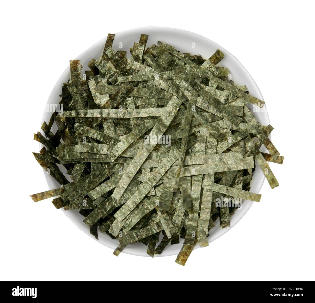 Bowl with chopped crispy nori sheets isolated on white, top view Stock ...