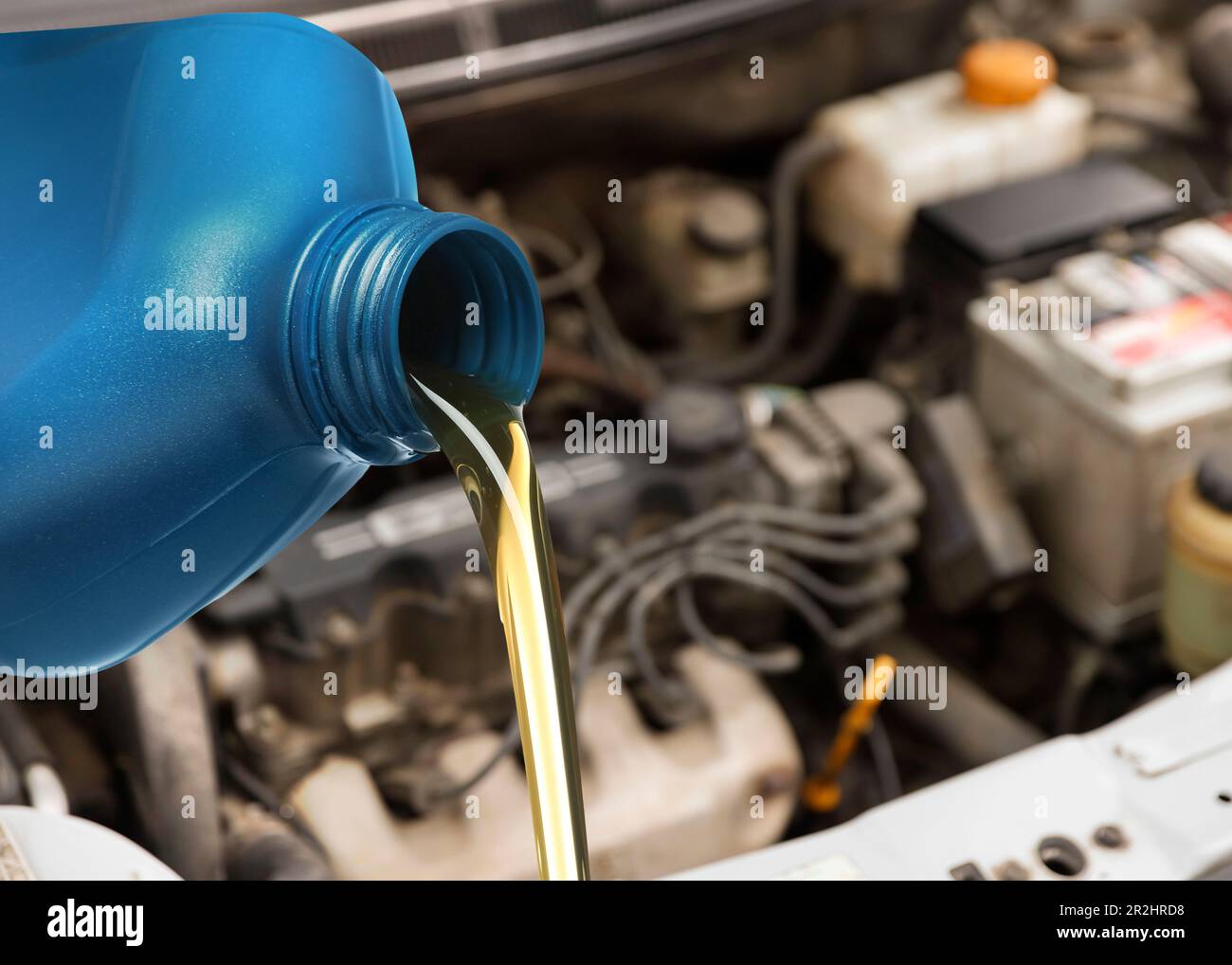 Pouring motor oil from blue container container, closeup Stock Photo ...