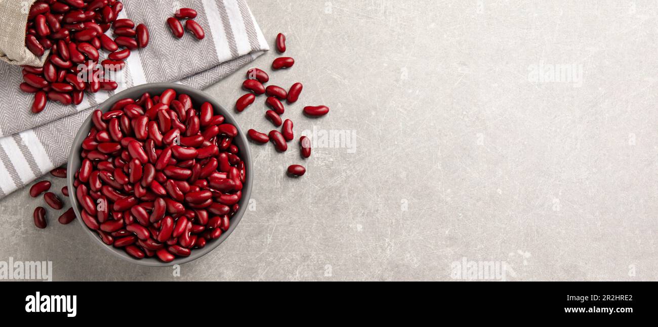 Red kidney beans and space for text on light grey table, flat lay ...