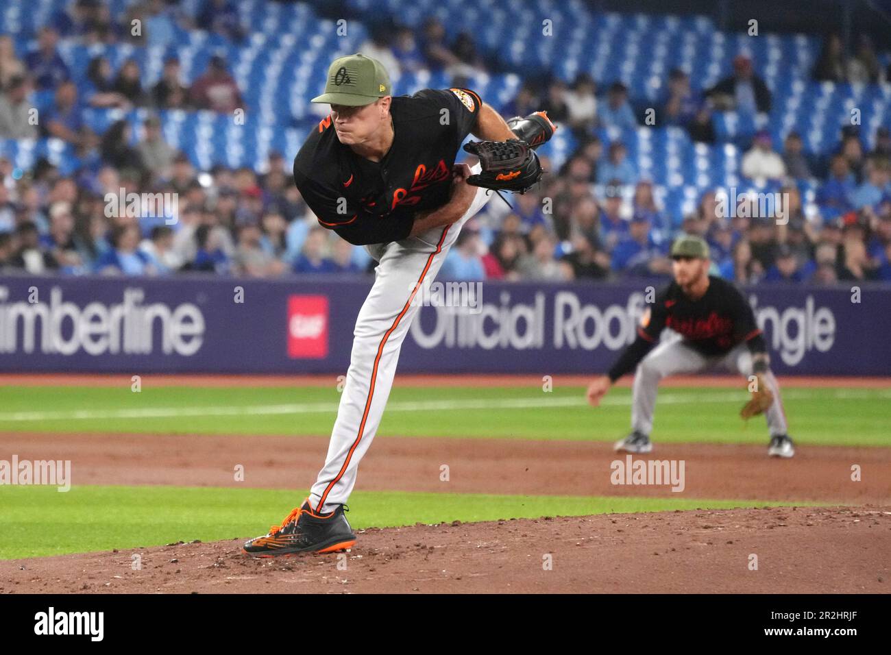 Baltimore Orioles starting pitcher Kyle Gibson watches a throws to a ...