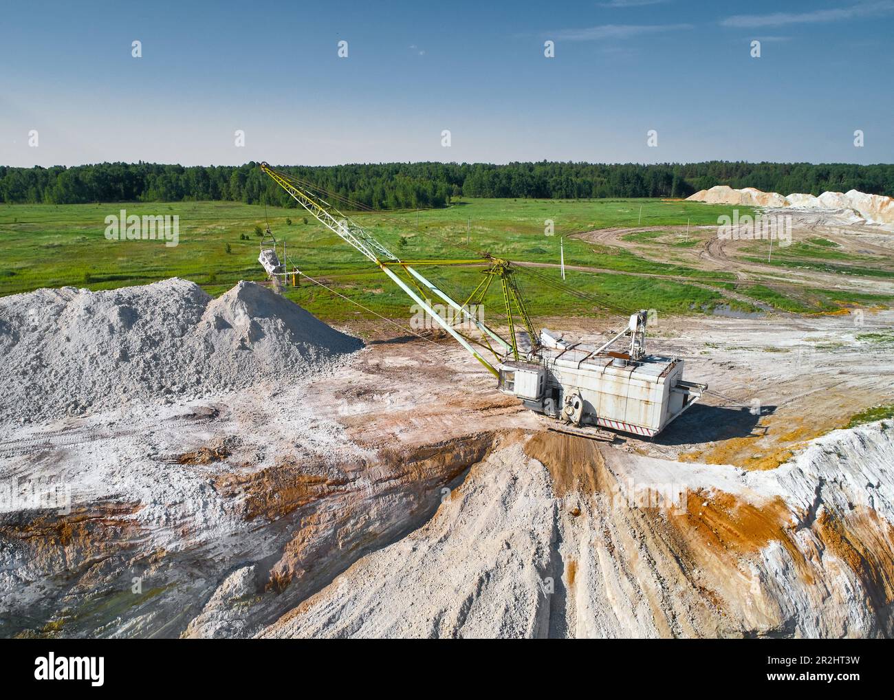 Walking dragline digs chalk in quarry on summer day Stock Photo - Alamy