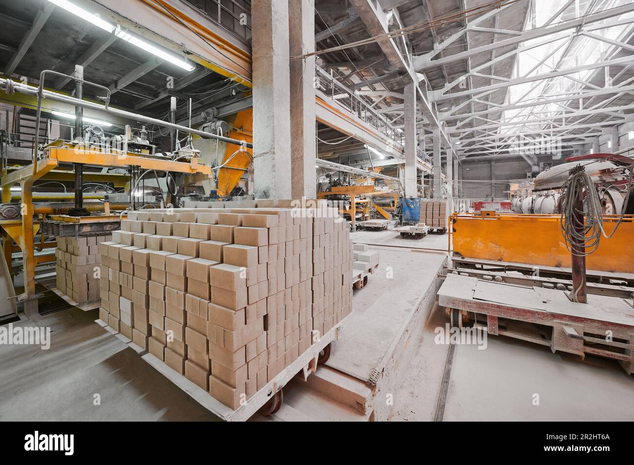 Pack of raw bricks prepared at plant storage department Stock Photo - Alamy
