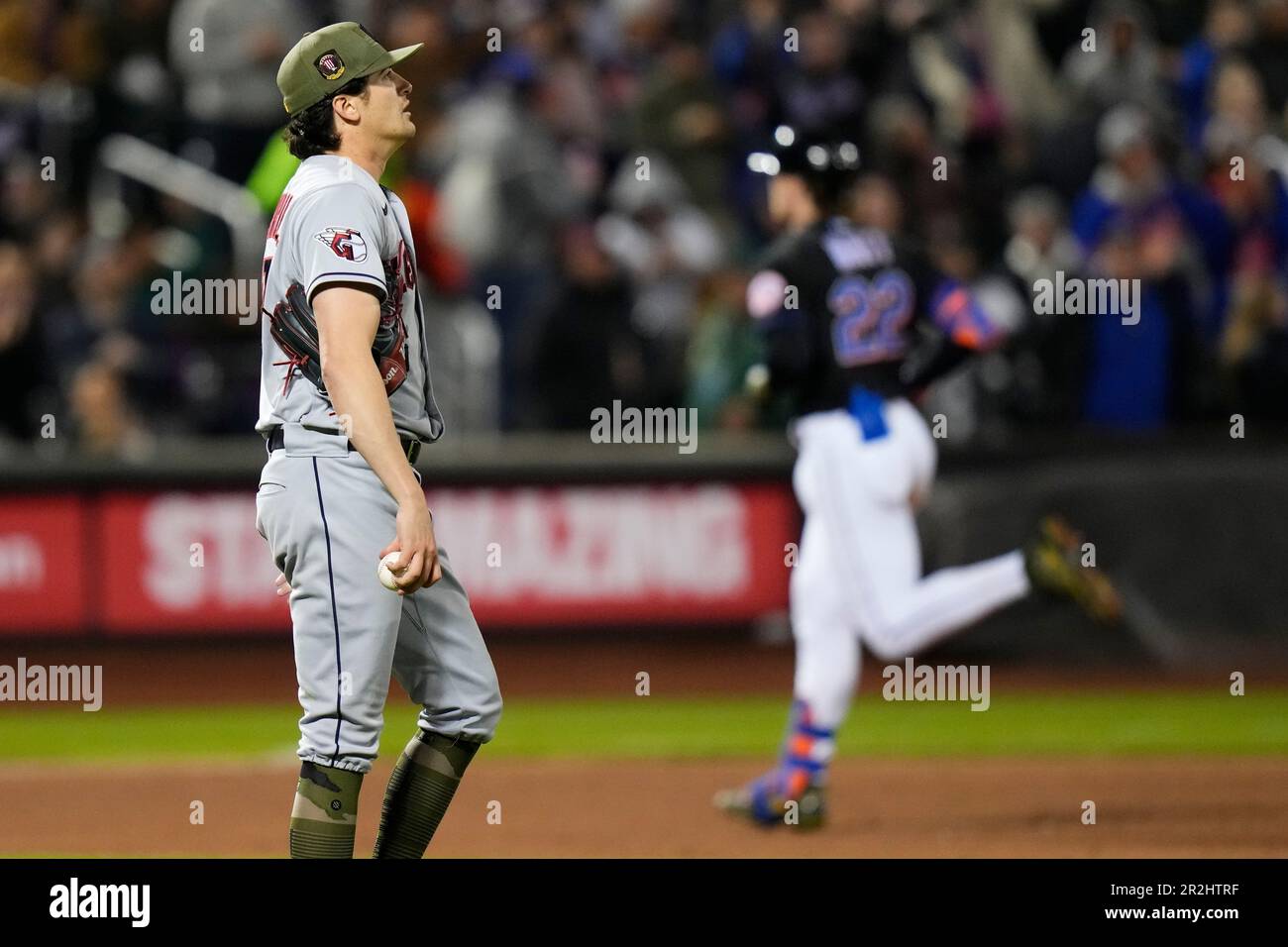Cleveland Guardians starting pitcher Cal Quantrill, left, waits as New ...
