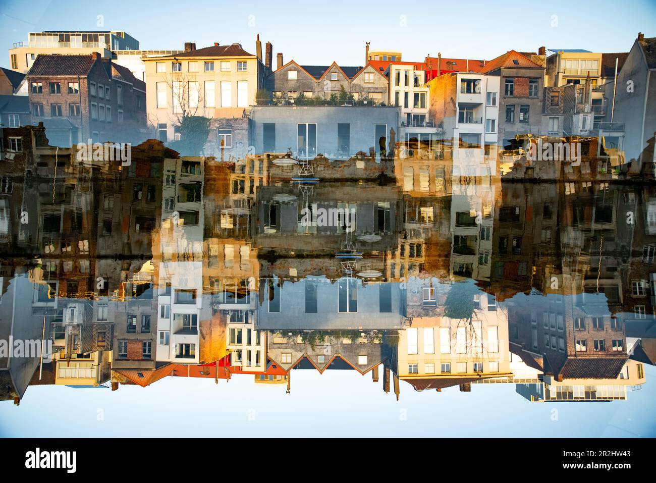 Double exposure photo of buildings reflected in water in Gent, Belgium ...
