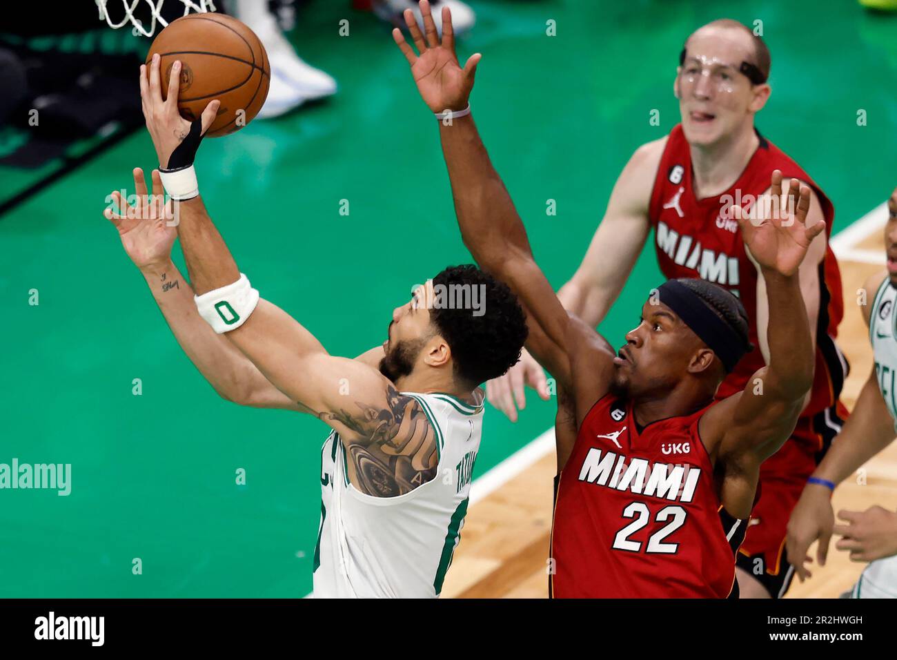 Boston Celtics forward Jayson Tatum, left, shoots against Miami Heat ...