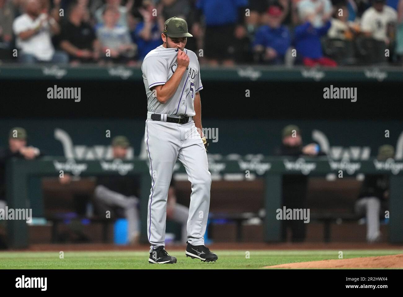 Colorado Rockies starting pitcher Karl Kauffmann wipes his face after ...