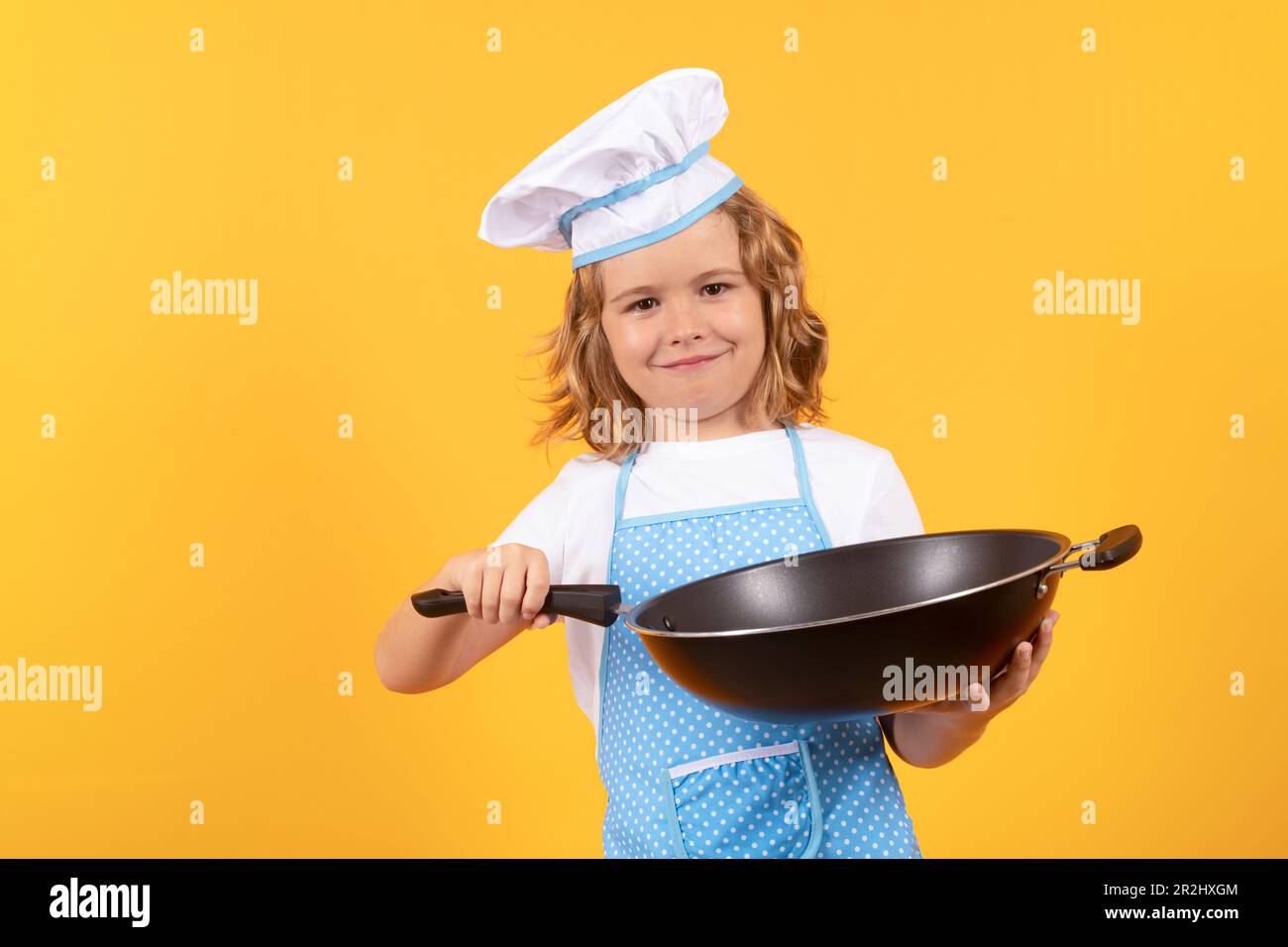 Little cook with cooking pan. Chef kid boy making healthy food ...