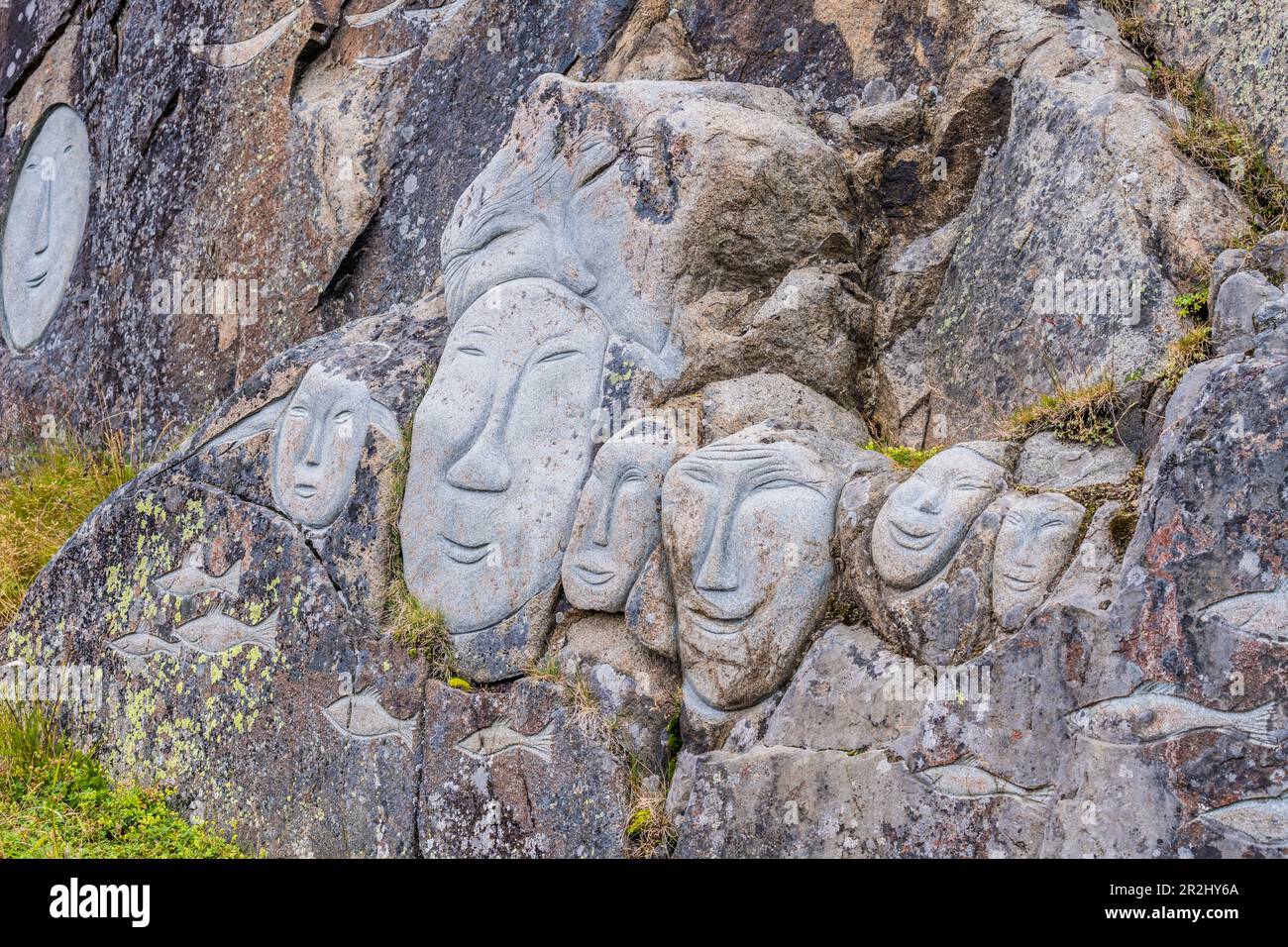 Faces on the rock, stone art project Stock Photo - Alamy