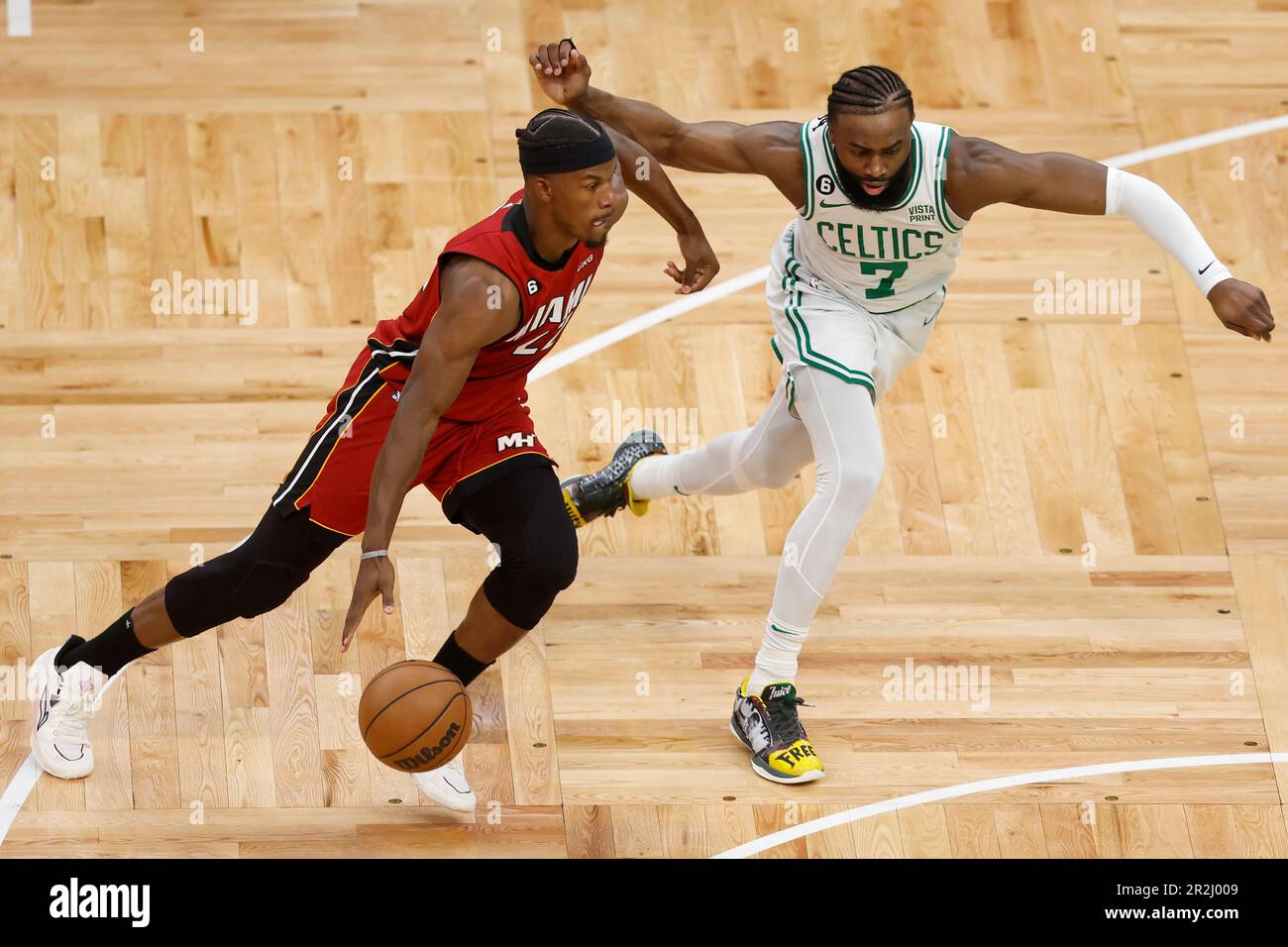 Miami Heat forward Jimmy Butler, left, drives to the basket against Boston Celtics guard Jaylen ...