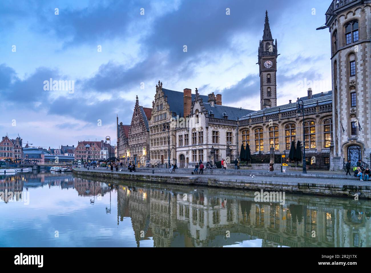 Medieval guild houses of the Graslei quay on the Leie river at dusk ...