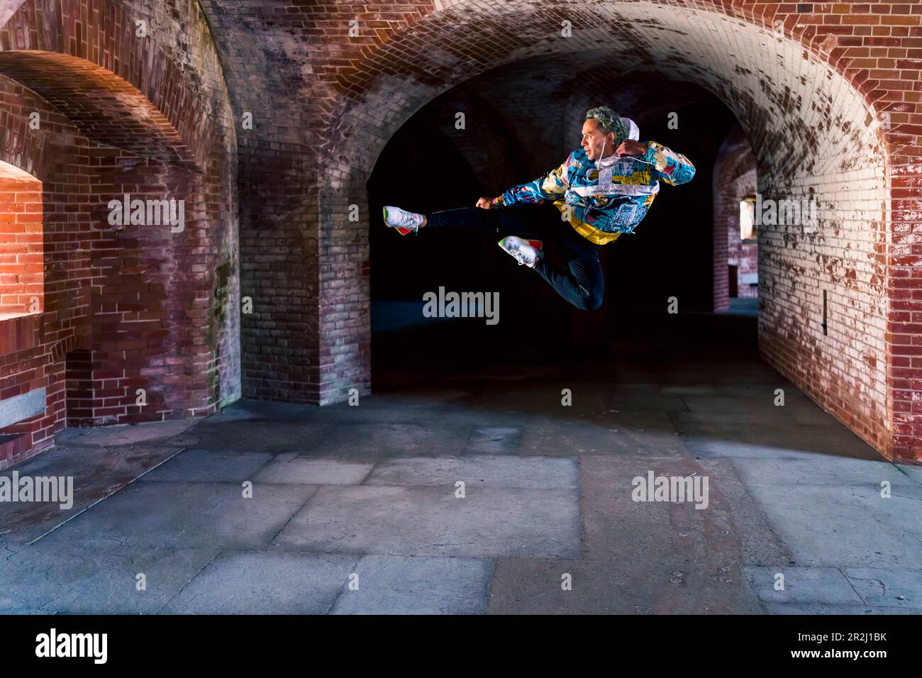 MMA fighter practicing jump kicks Stock Photo - Alamy
