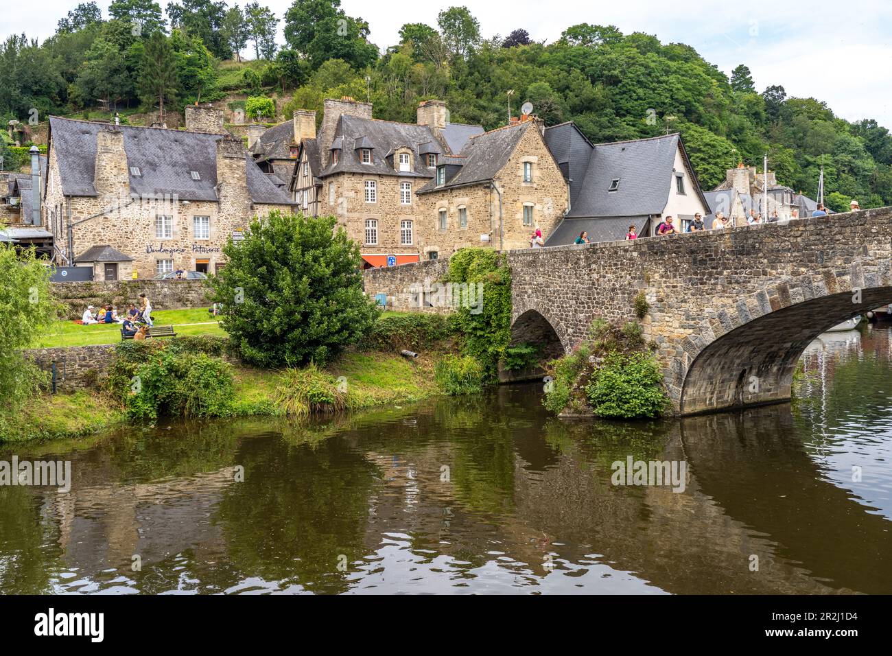 Medieval buildings and stone bridge on the Rance river in Dinan ...