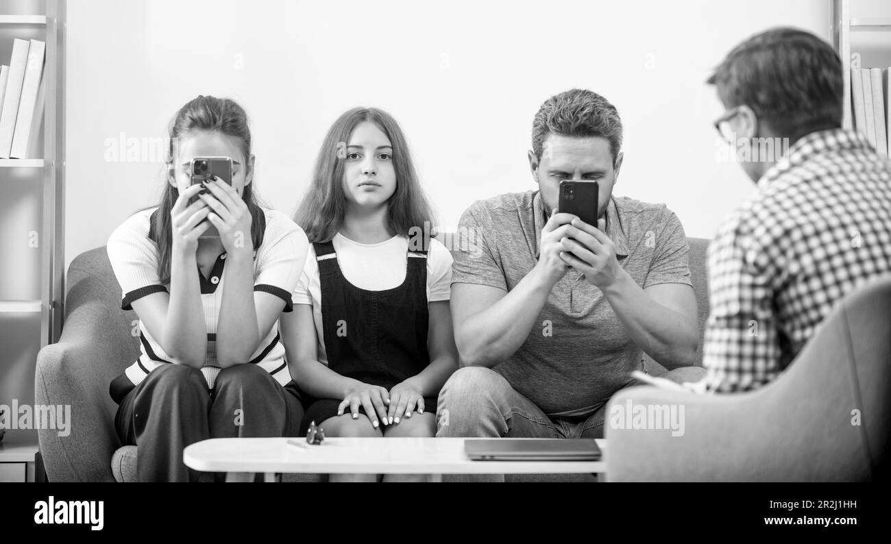 family therapy. parents with girl talk to social worker. phone addicted ...